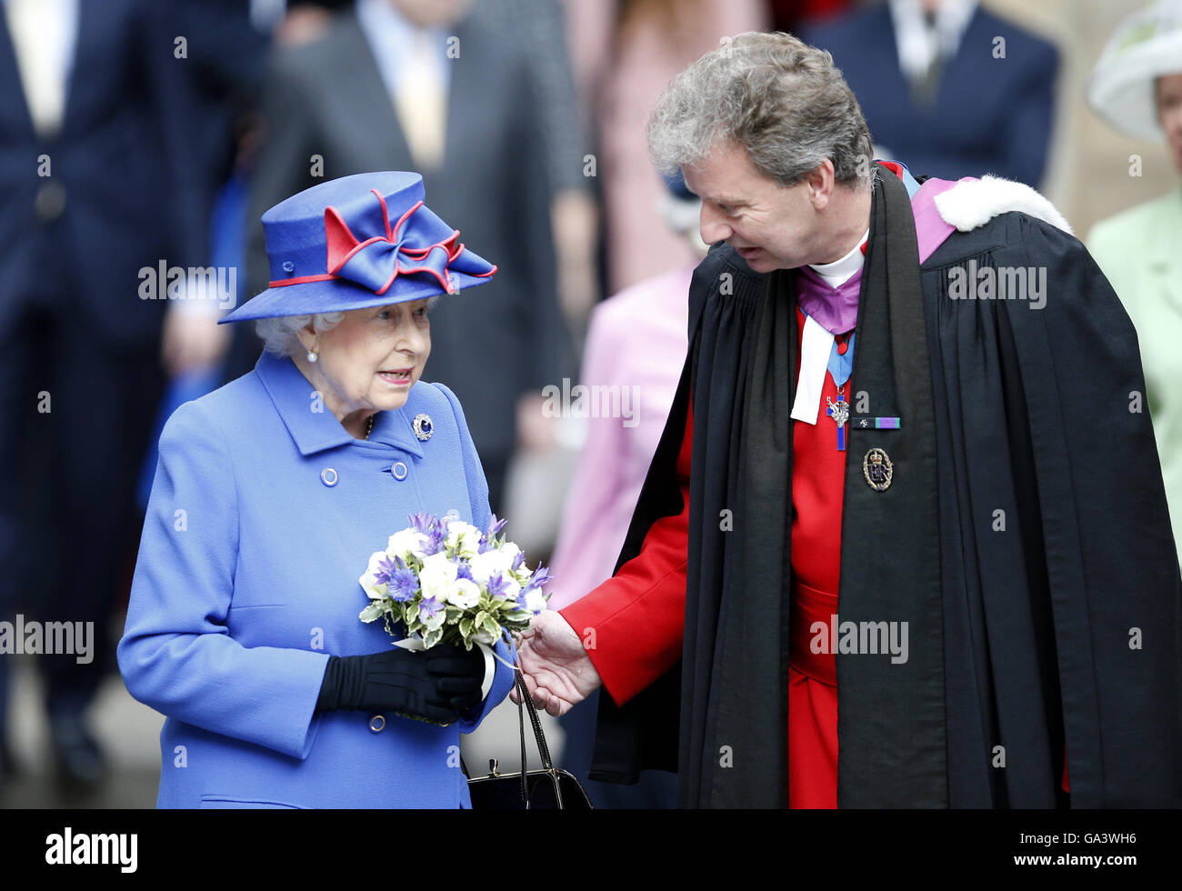 Queen Elizabeth II with the Reverend Neil Gardner (right), as she ...