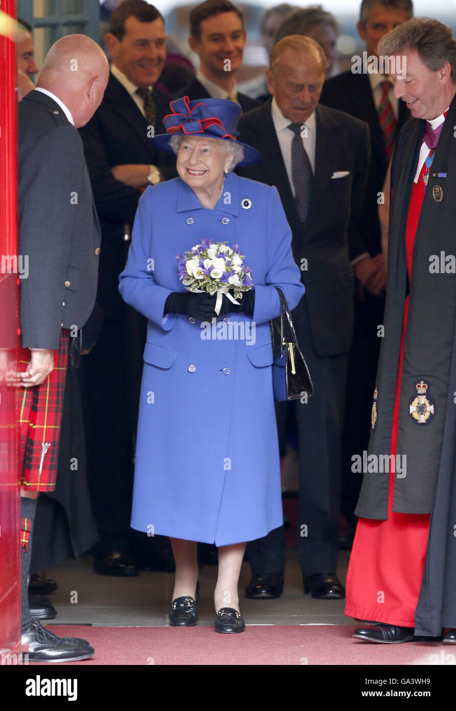 Queen Elizabeth II with the Reverend Neil Gardner (right), as she ...