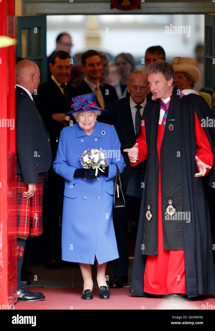Queen Elizabeth II with the Reverend Neil Gardner (right), as she ...