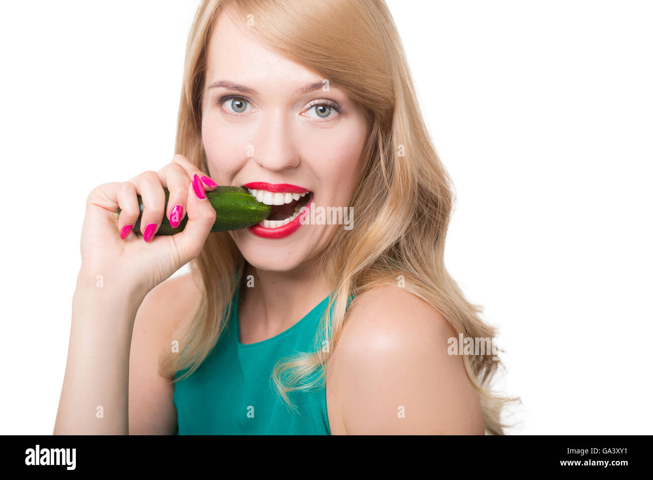 young woman eating cucumber Stock Photo - Alamy