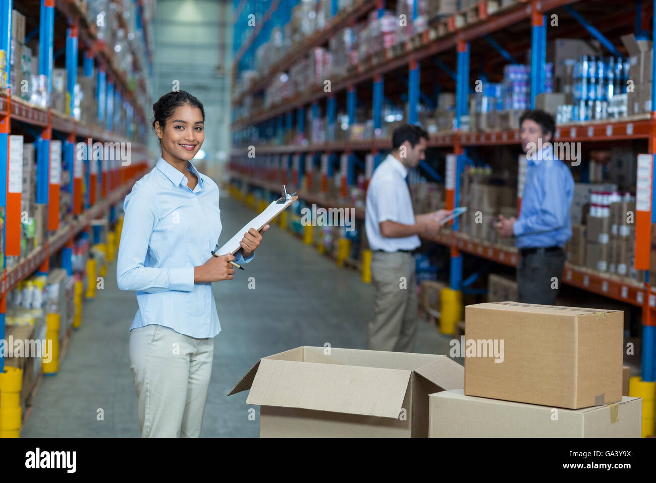 Focus of manager is smiling and posing during work Stock Photo - Alamy