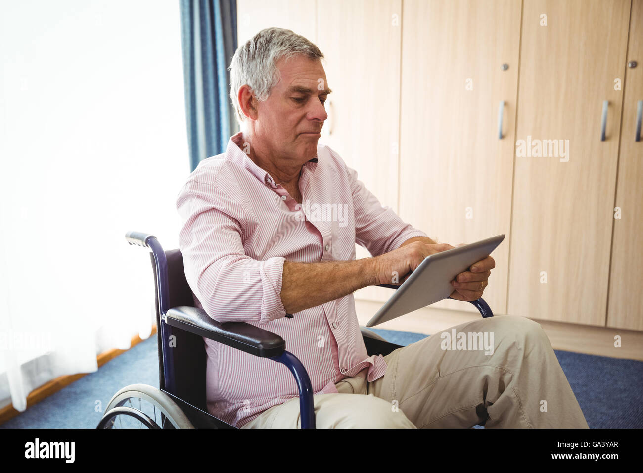 Wheelchair using retired senior hi-res stock photography and images - Alamy