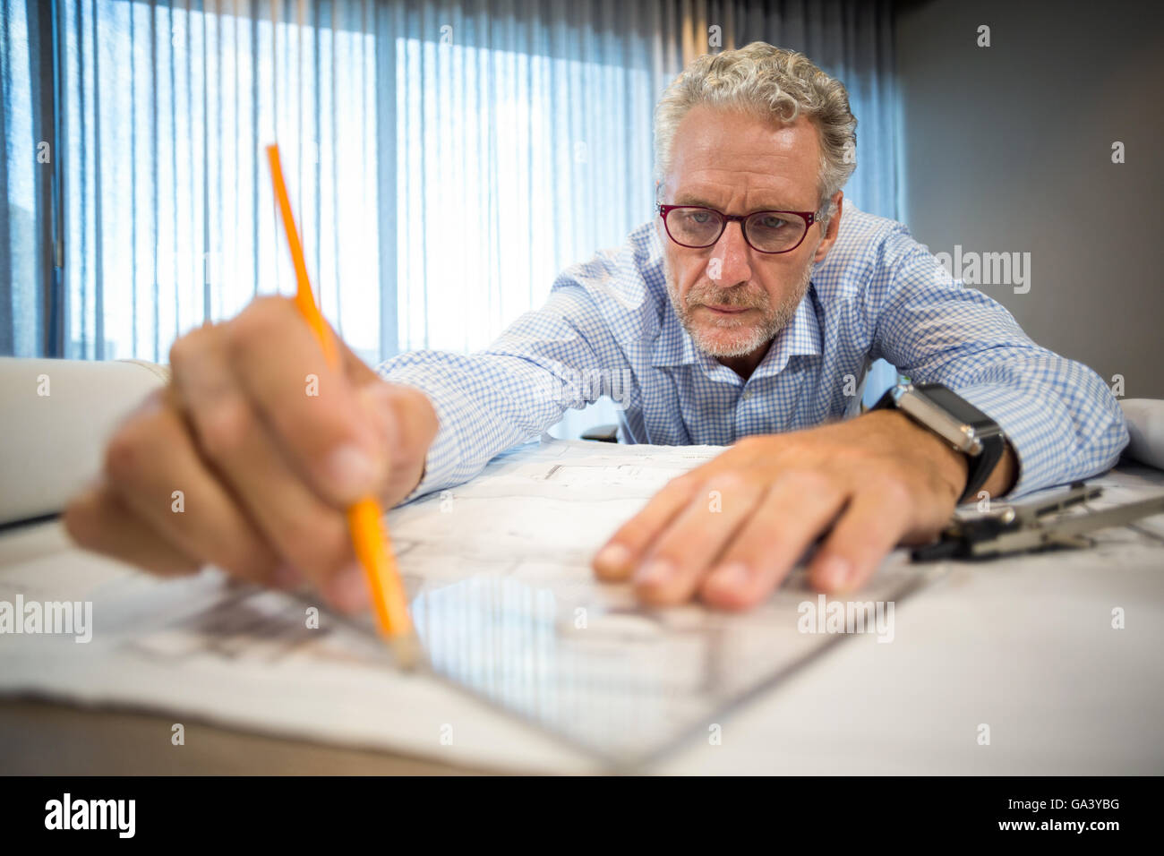 Man working on blueprint office hi-res stock photography and images - Alamy