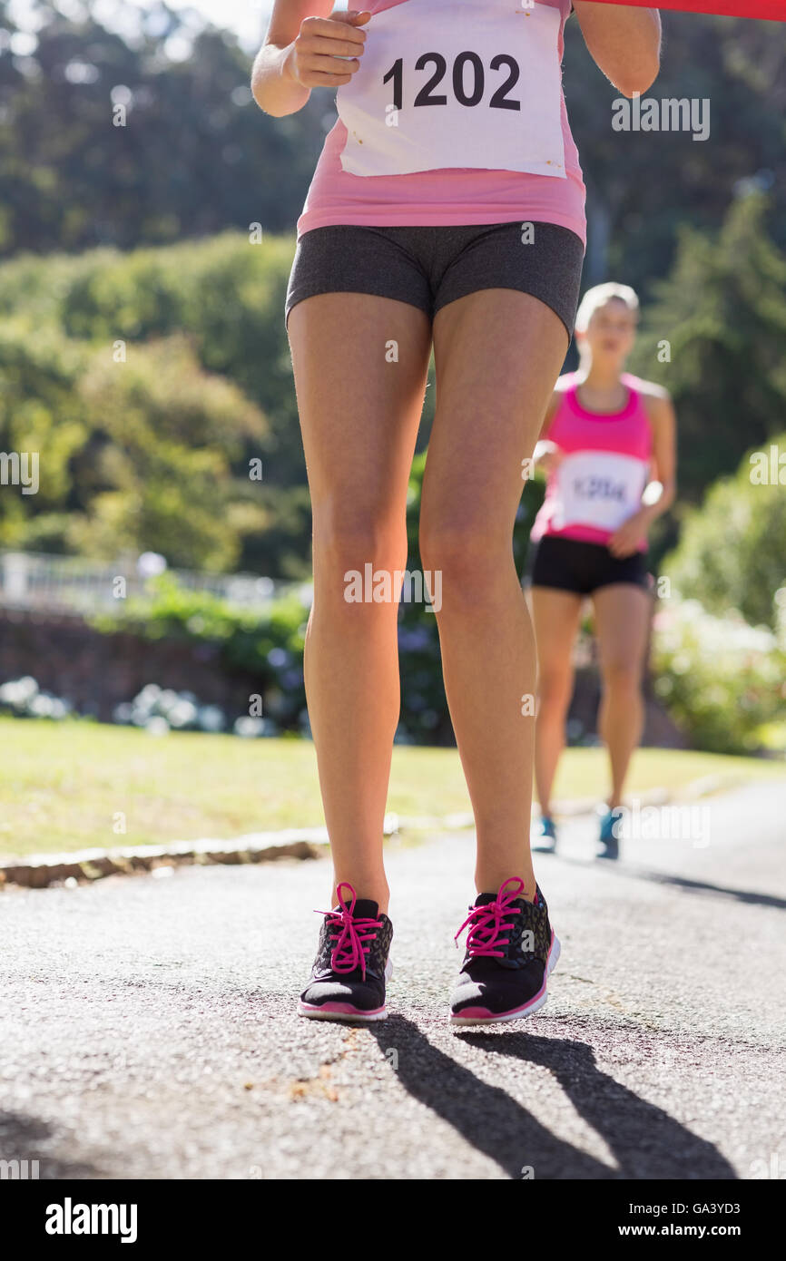 Female athlete standing on running track Stock Photo - Alamy