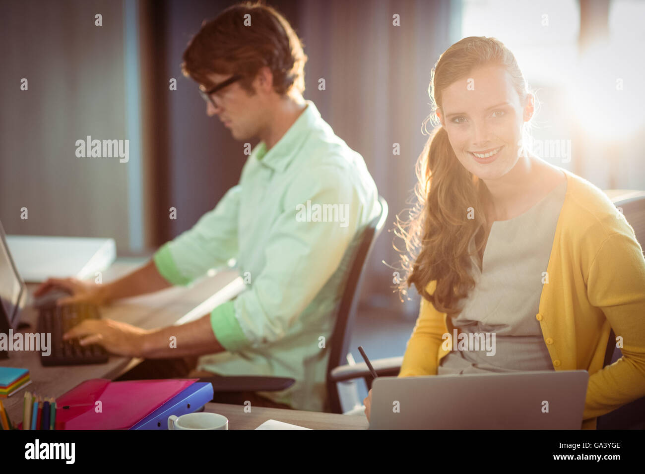 Pretty female coworker hi-res stock photography and images - Alamy