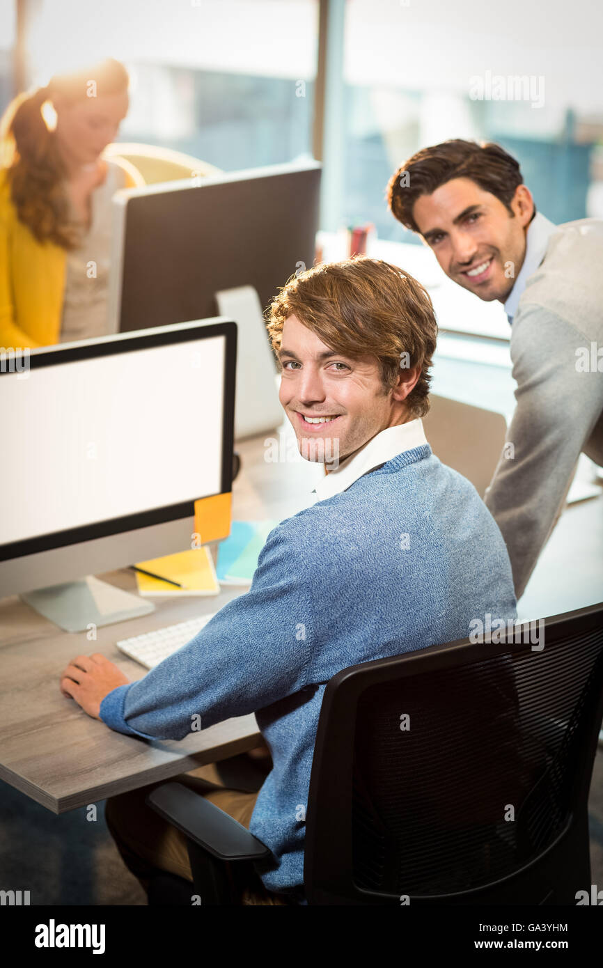 Men working on computer Stock Photo - Alamy