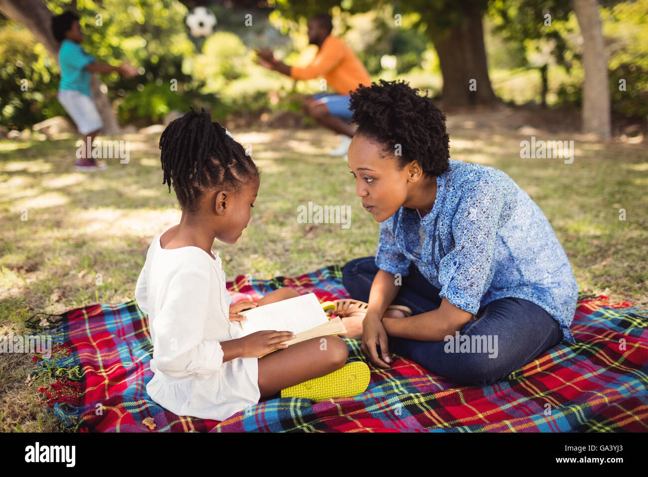 happy family reading together Stock Photo - Alamy