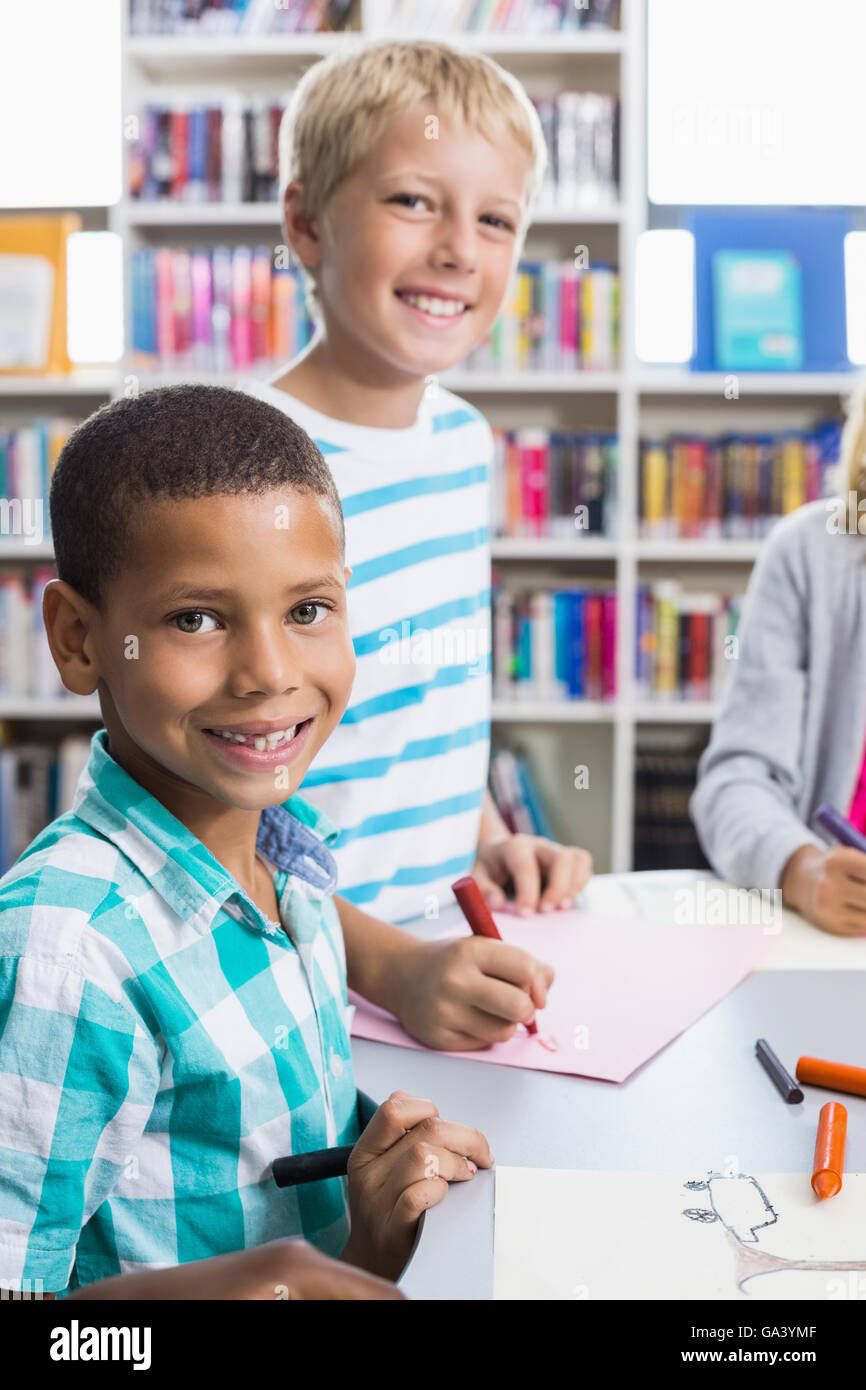 Portrait of kids in library Stock Photo - Alamy