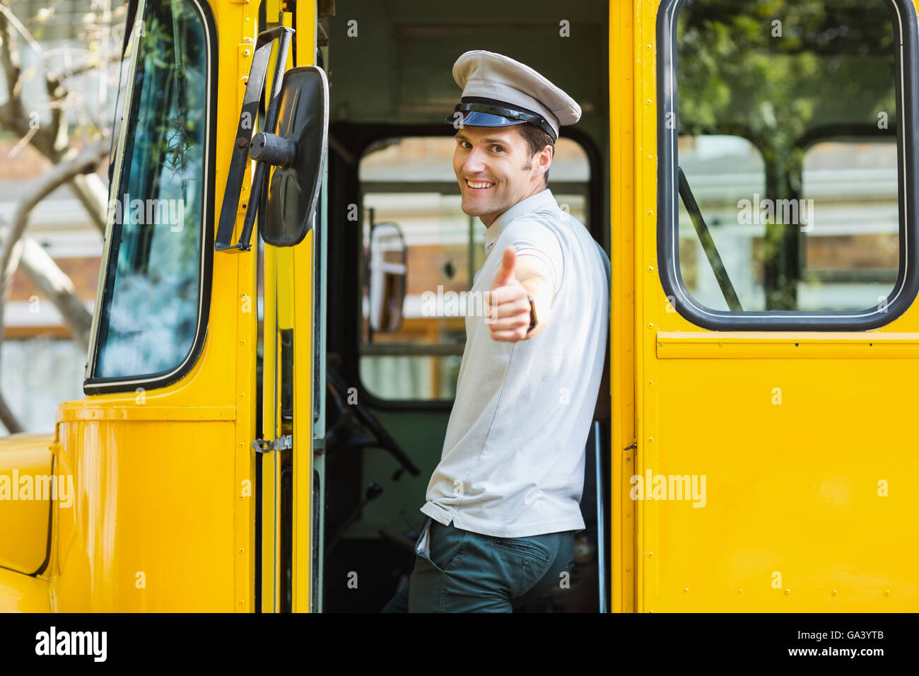 Bus driver showing thumbs up while entering in bus Stock Photo - Alamy