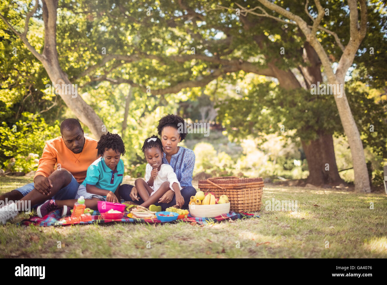 Happy family eating together Stock Photo - Alamy