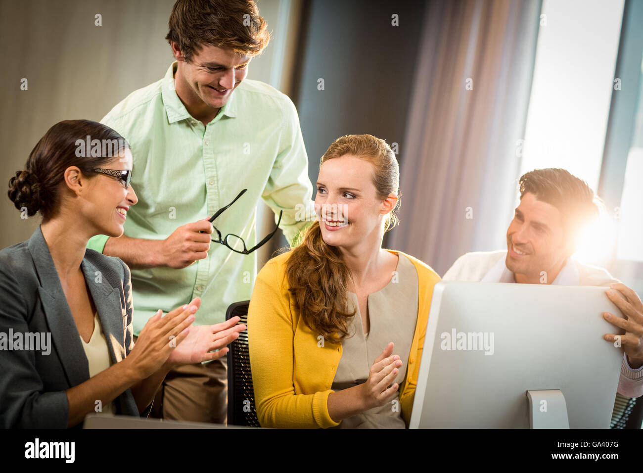 Business team appreciating clapping colleague hi-res stock photography ...