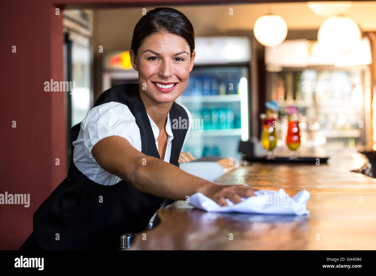 Waitress cleaning the counter Stock Photo - Alamy