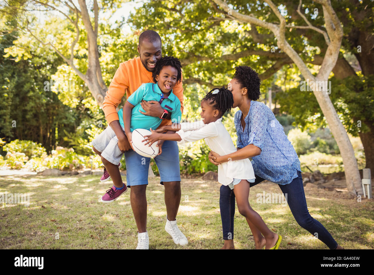 Happy family having fun Stock Photo - Alamy