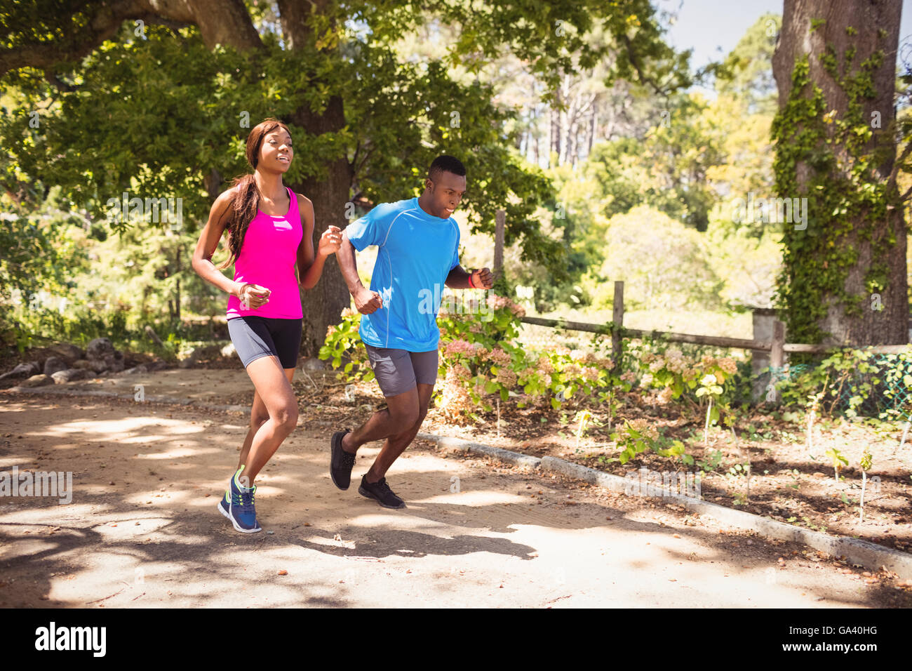 Couple running together Stock Photo - Alamy