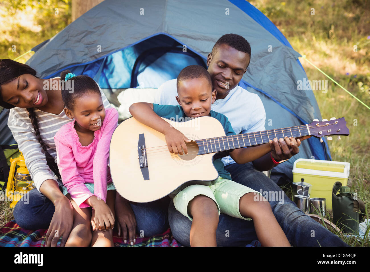 Happy family enjoying together Stock Photo - Alamy Happy family enjoying together Stock Photo - Alamy