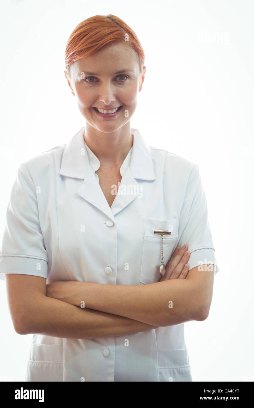 Portrait of a smiling nurse crossing arms Stock Photo - Alamy