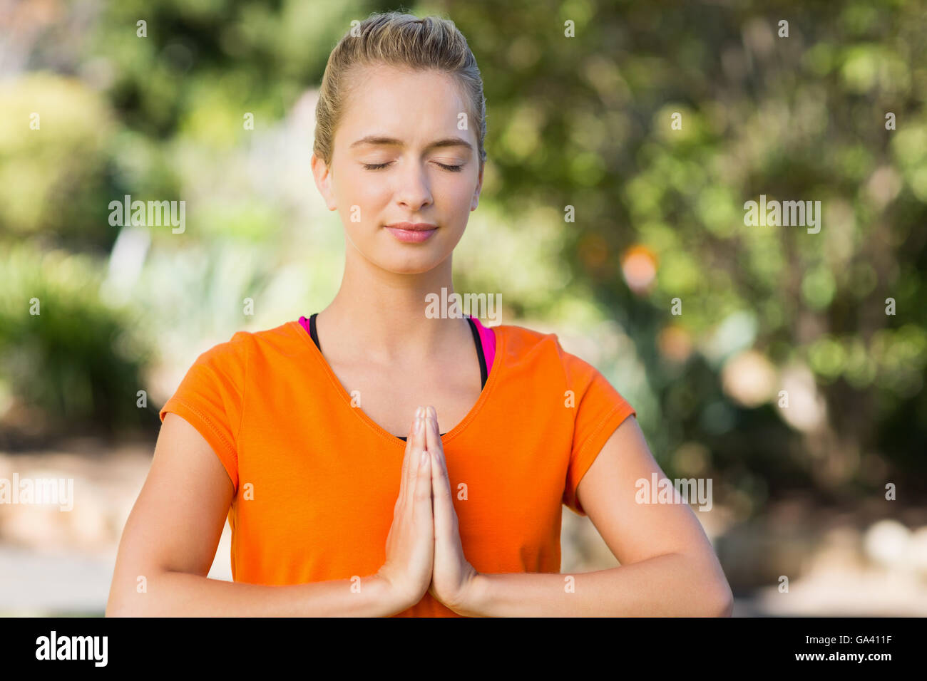 Young woman praying practicing hi-res stock photography and images - Alamy