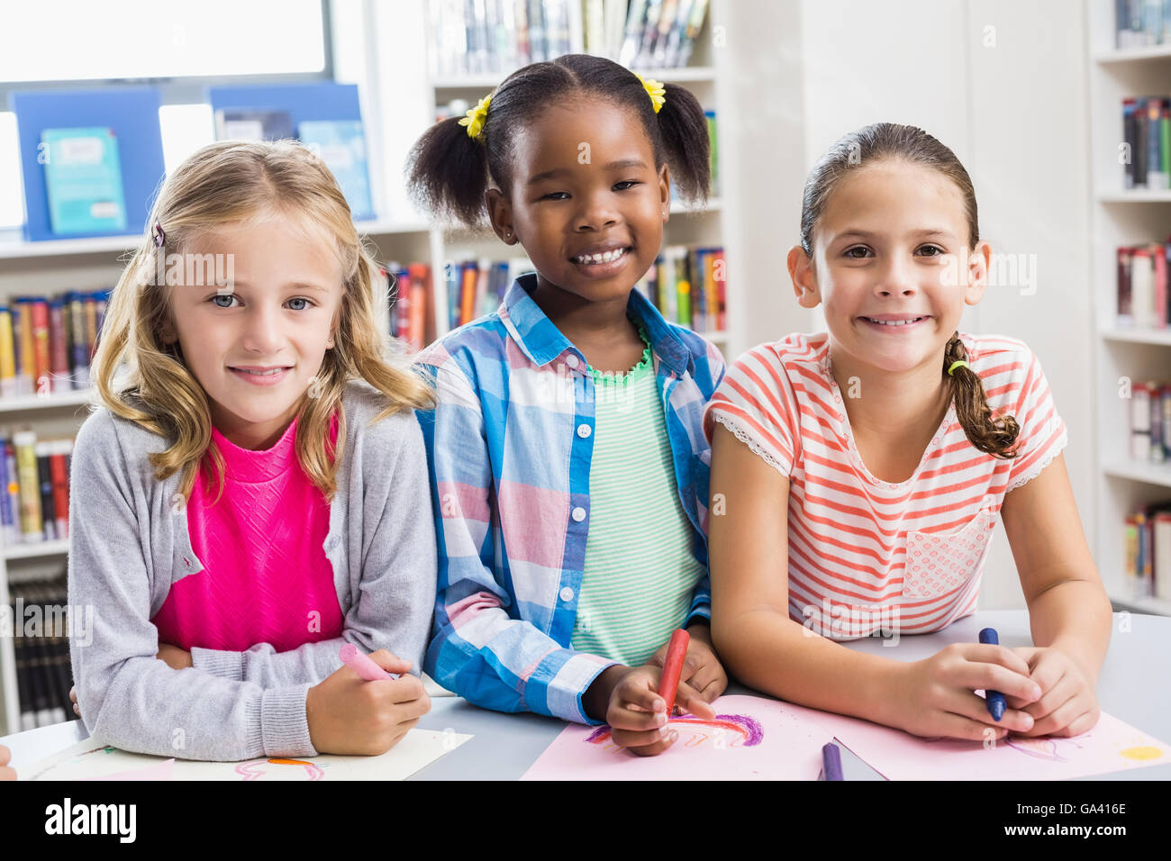 Portrait of kids in library Stock Photo - Alamy