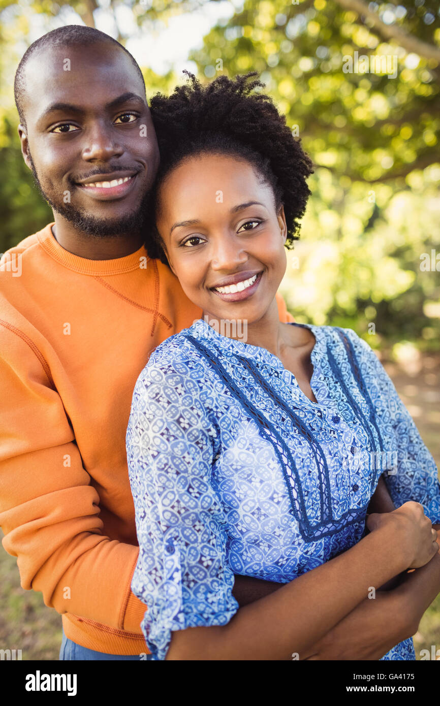 Happy couple posing together Stock Photo - Alamy