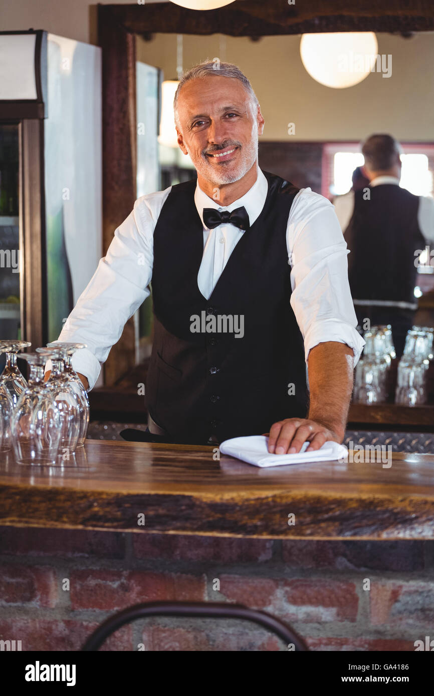 Portrait of bartender cleaning bar counter Stock Photo - Alamy
