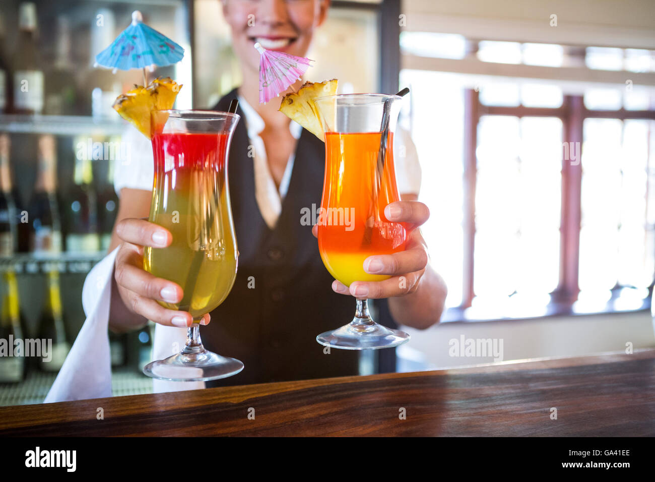 Woman handing over drink hi-res stock photography and images - Alamy