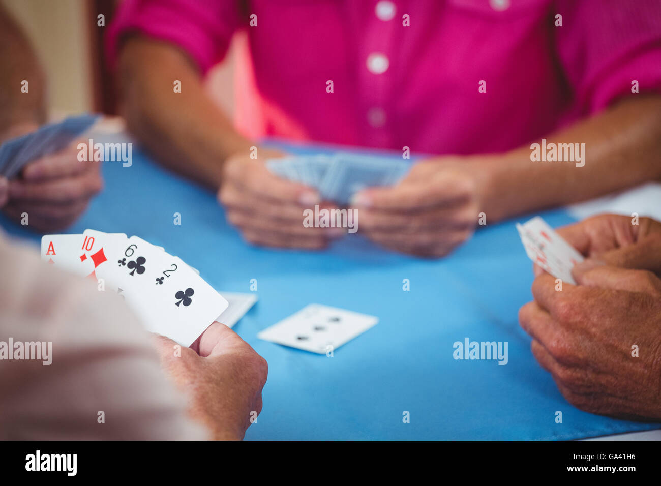 Retired people playing card Stock Photo - Alamy