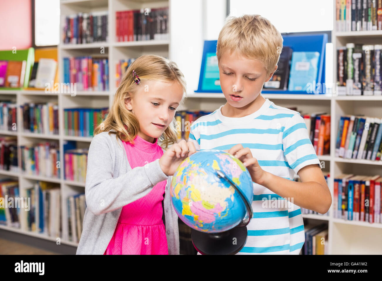 Kids studying in library hi-res stock photography and images - Alamy