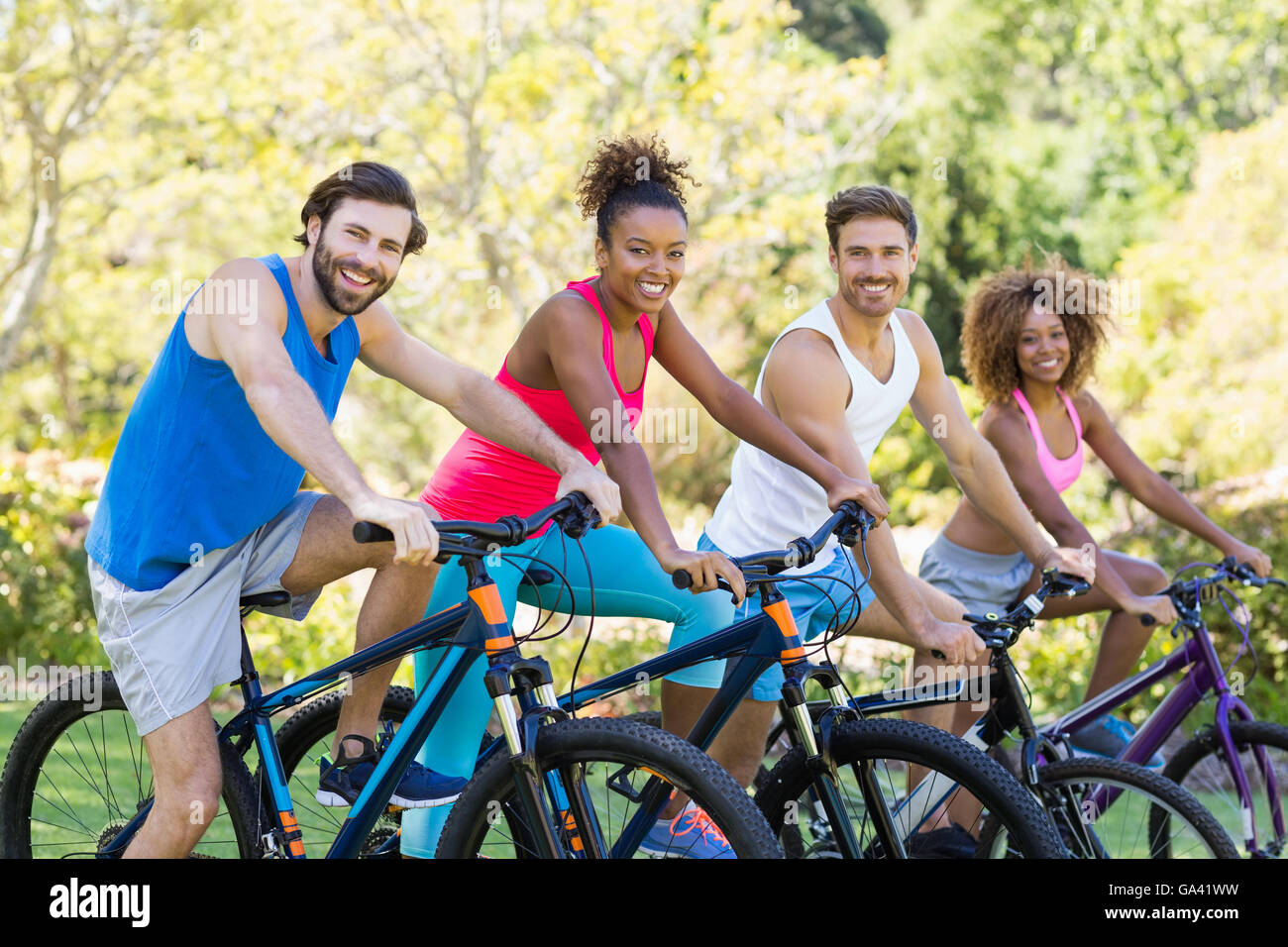 Group of friends ready for cycling Stock Photo - Alamy