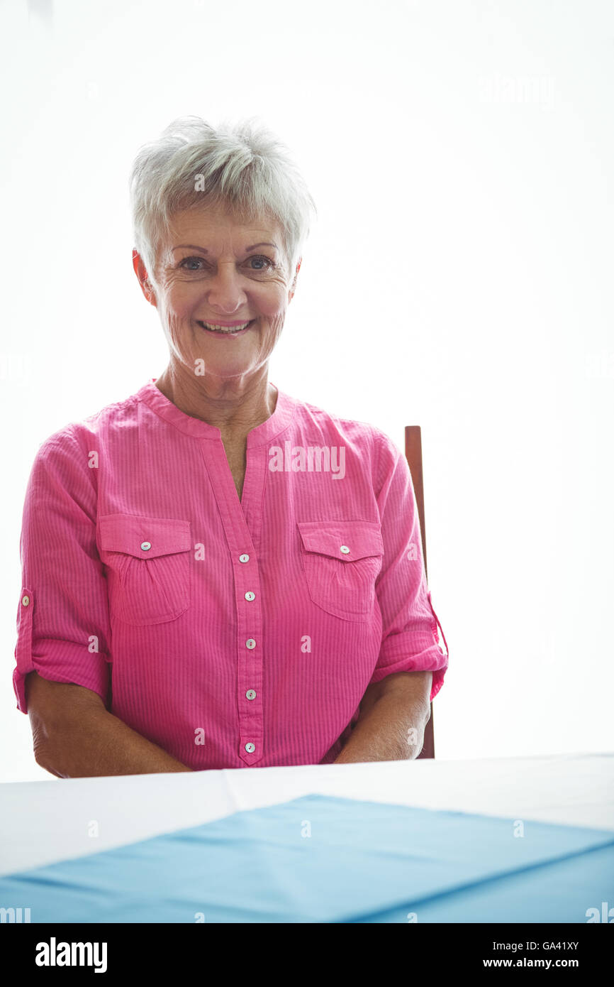 Portrait of a smiling retired woman Stock Photo - Alamy