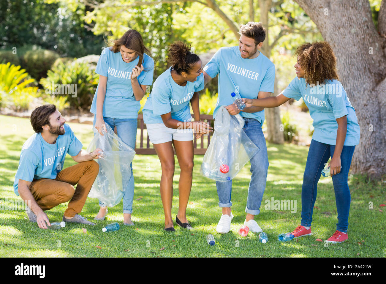Group of volunteer collecting rubbish Stock Photo - Alamy