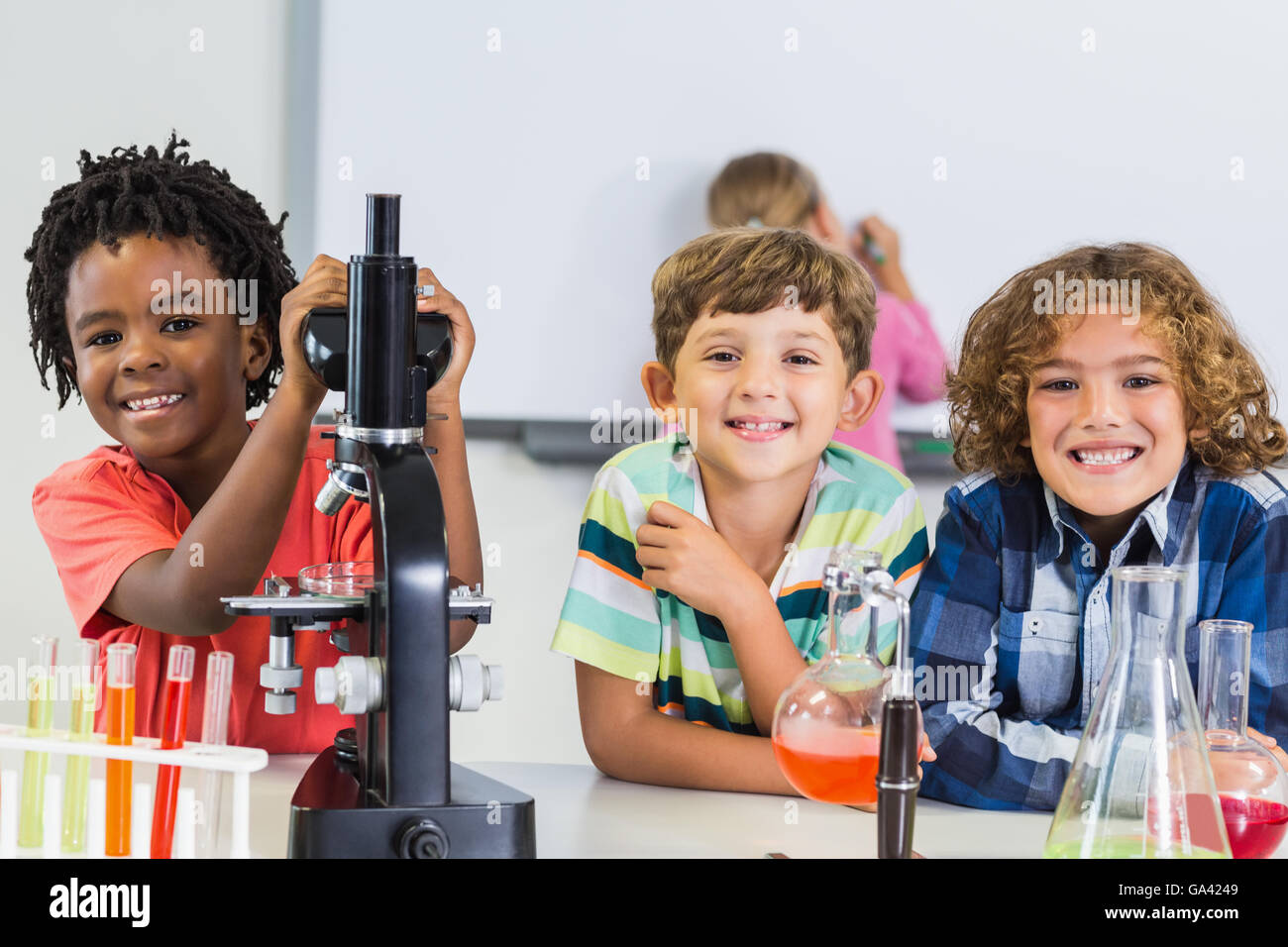 Portrait of kids doing experiment in laboratory Stock Photo - Alamy