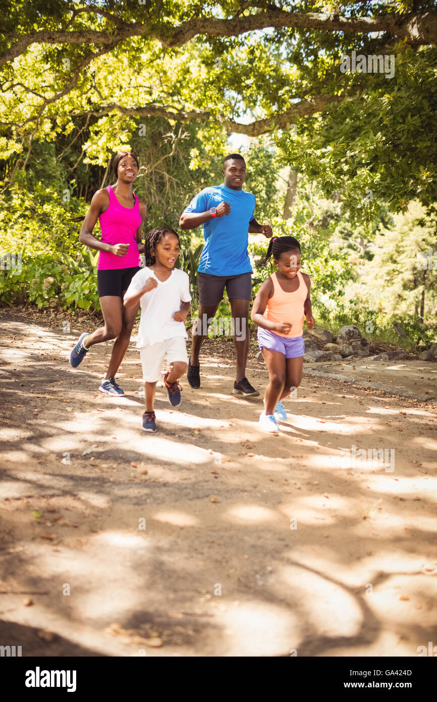 Happy family running hi-res stock photography and images - Alamy