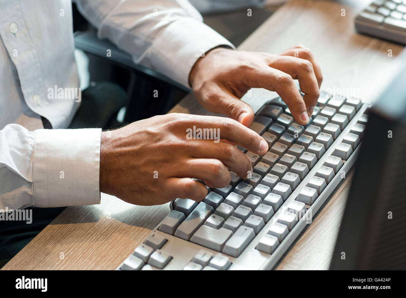 Man using computer keyboard Stock Photo - Alamy