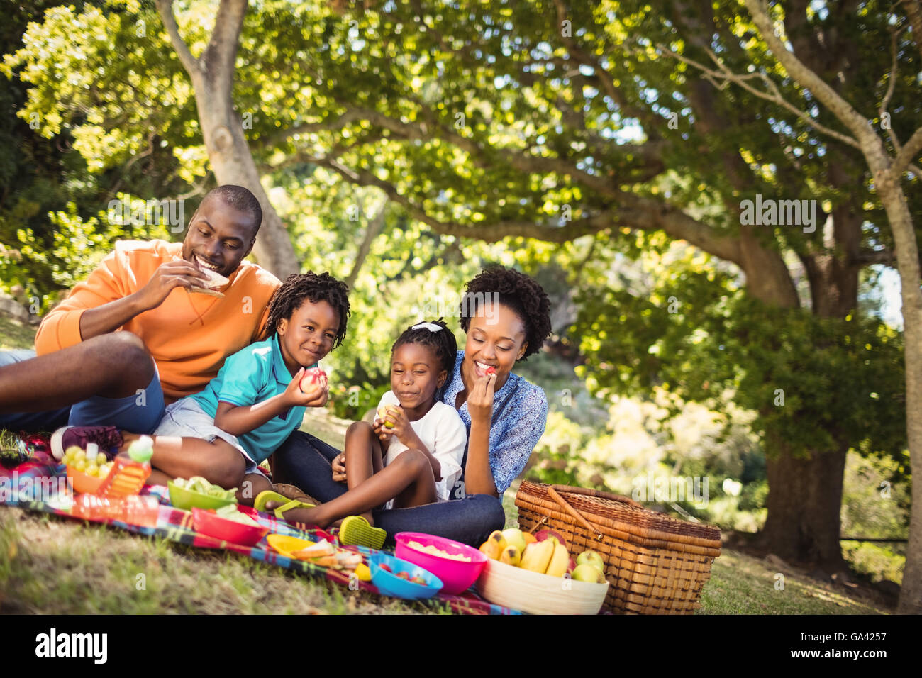 Happy family eating together Stock Photo - Alamy