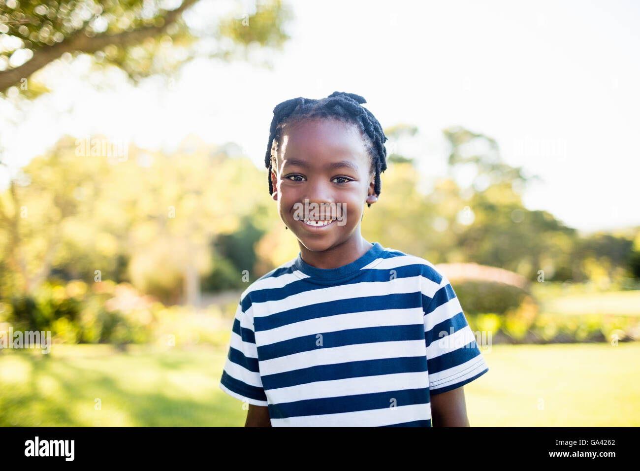 Boy smiling in front of the camera Stock Photo - Alamy