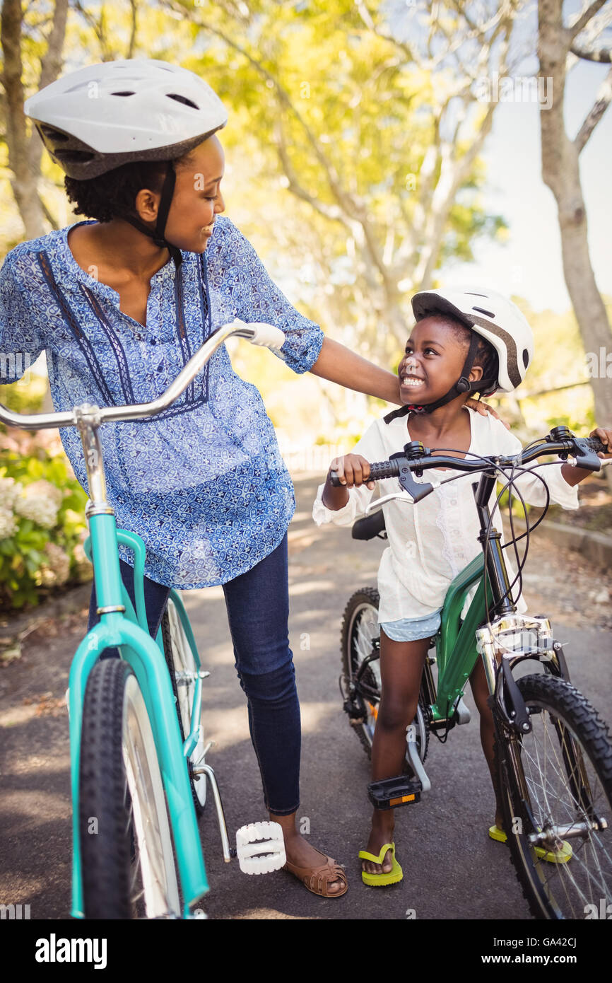 Happy family doing bicycle Stock Photo - Alamy