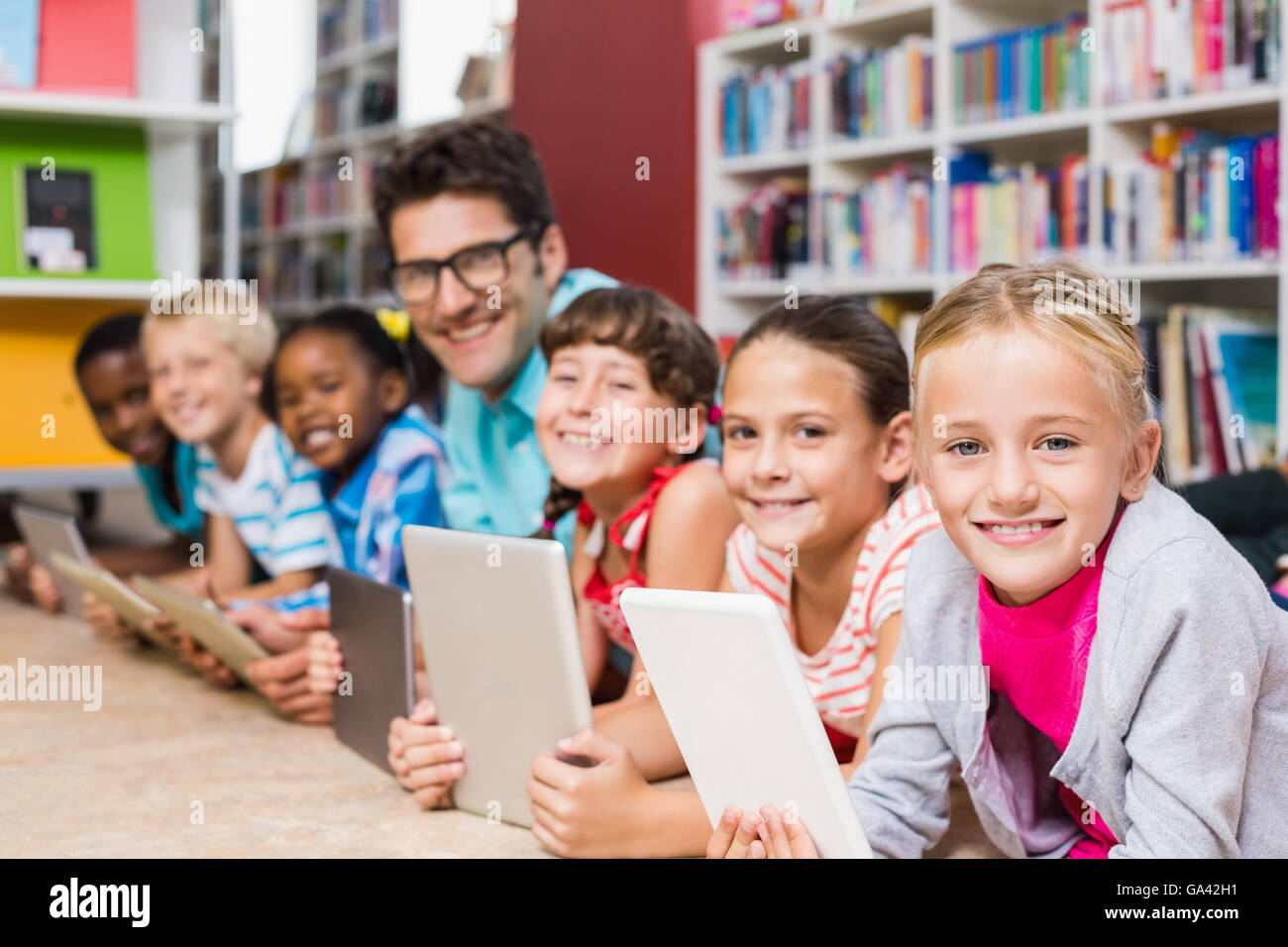Boy And Girl In A Library And Computer High Resolution Stock ...