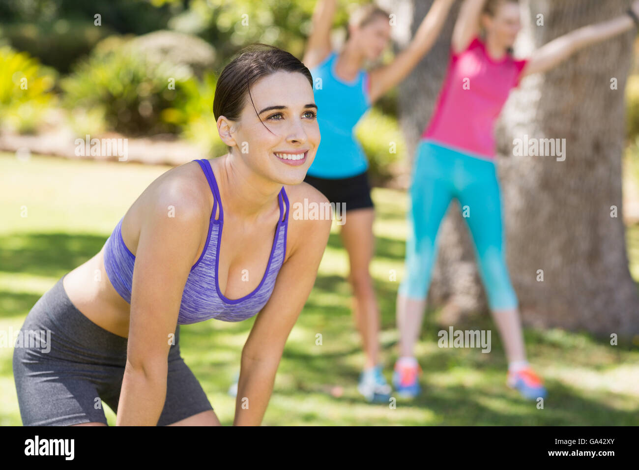 Beautiful young woman taking a break after work out Stock Photo - Alamy