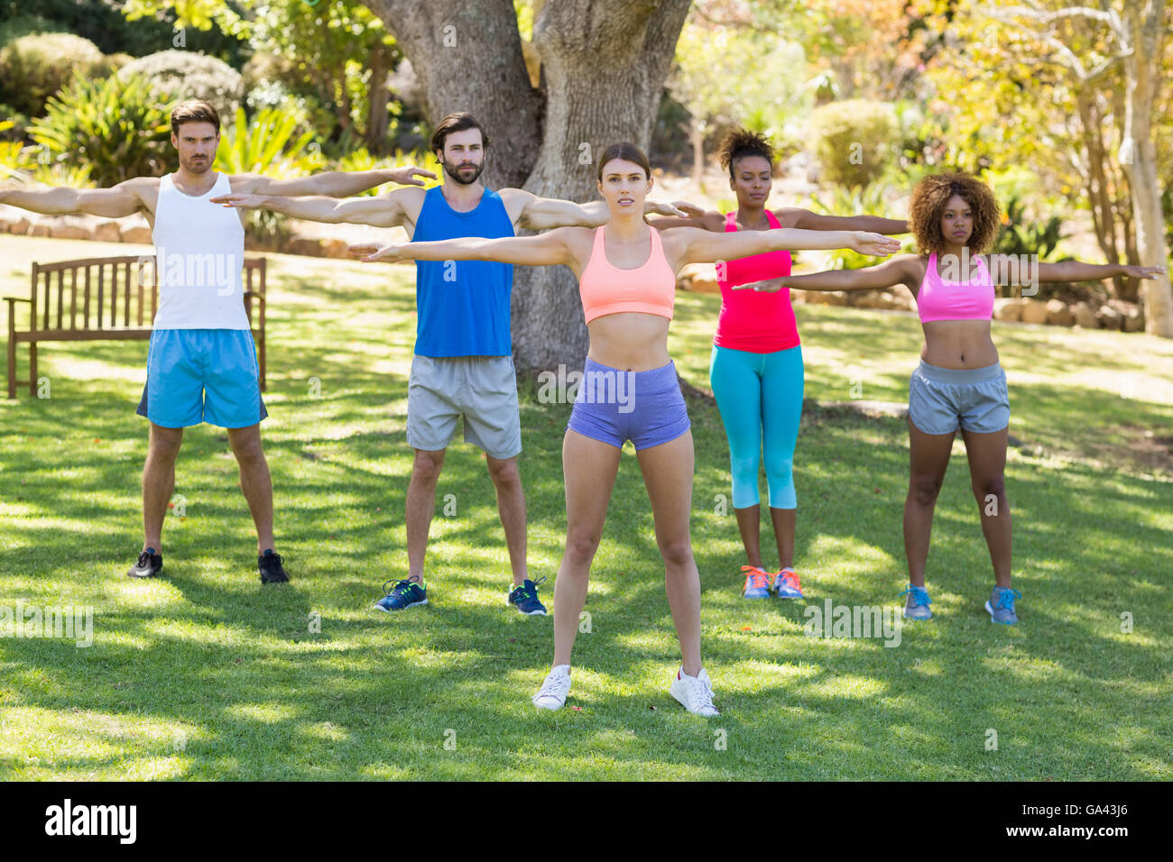 Group of friends exercising Stock Photo - Alamy