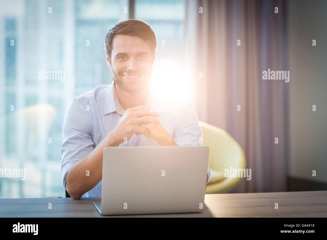 Man sitting at his desk Stock Photo - Alamy
