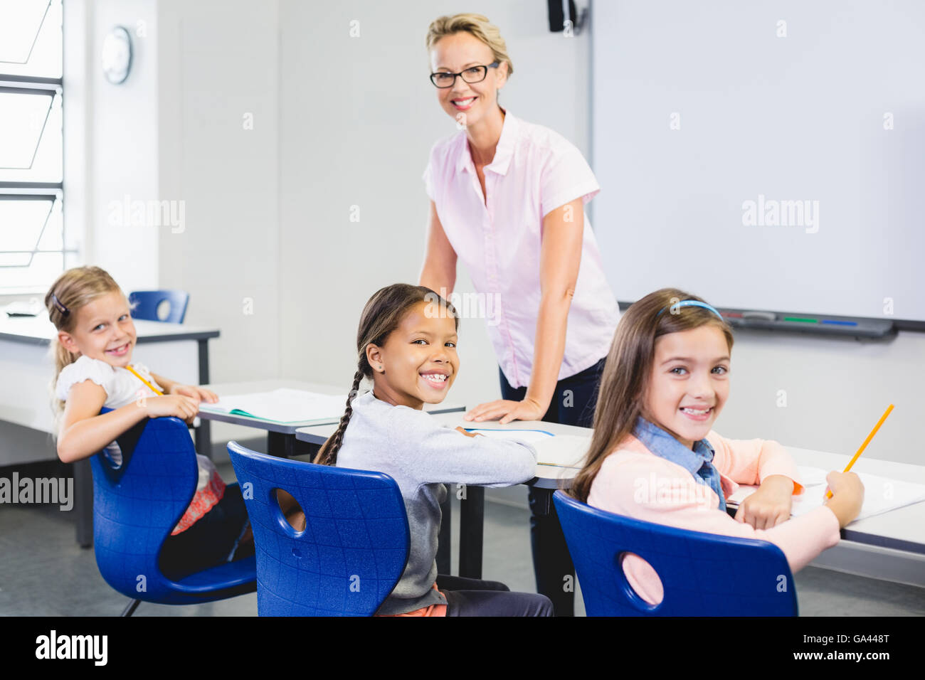 Kids and teacher classroom hi-res stock photography and images - Alamy