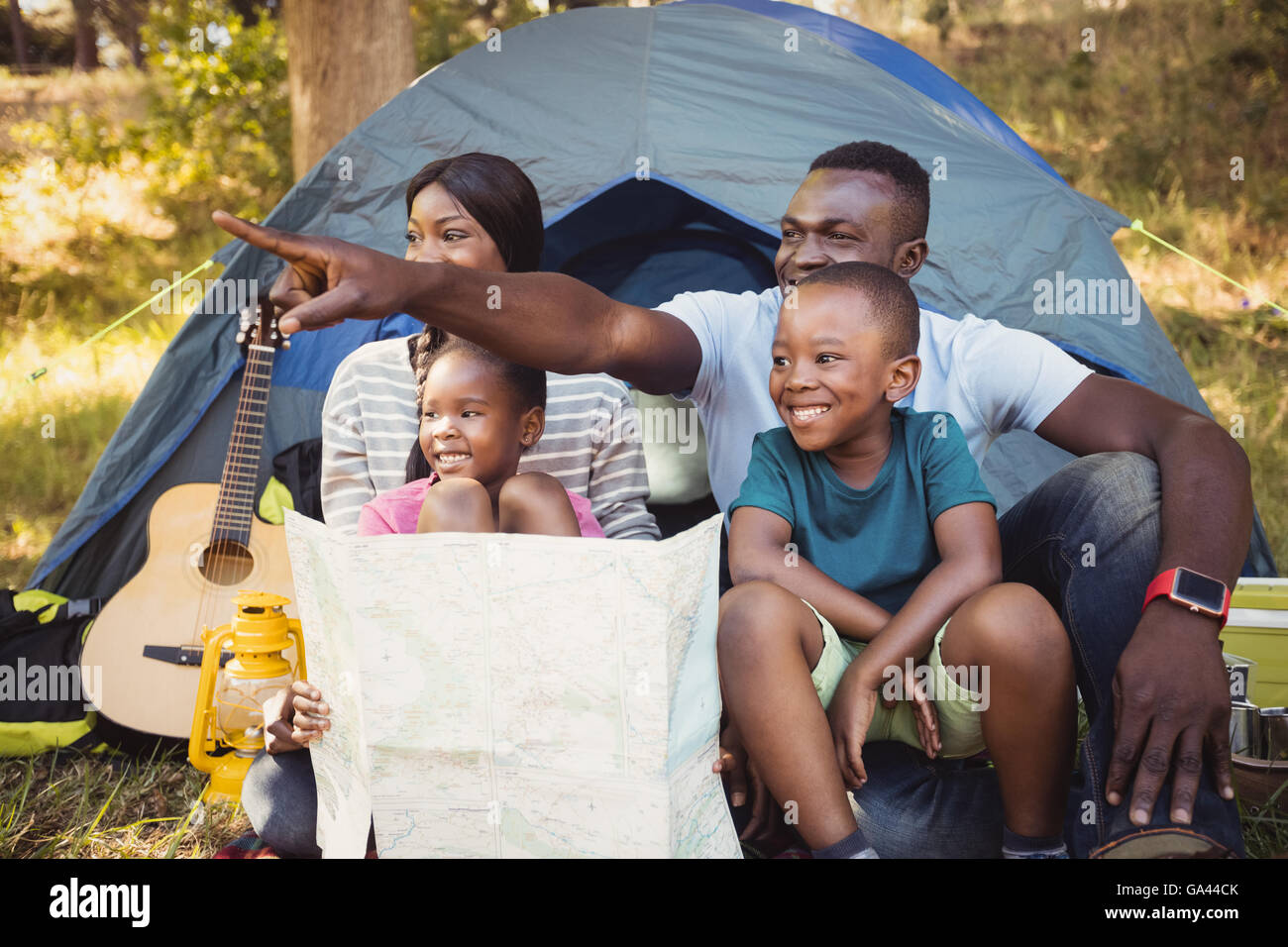 Happy family enjoying together Stock Photo - Alamy