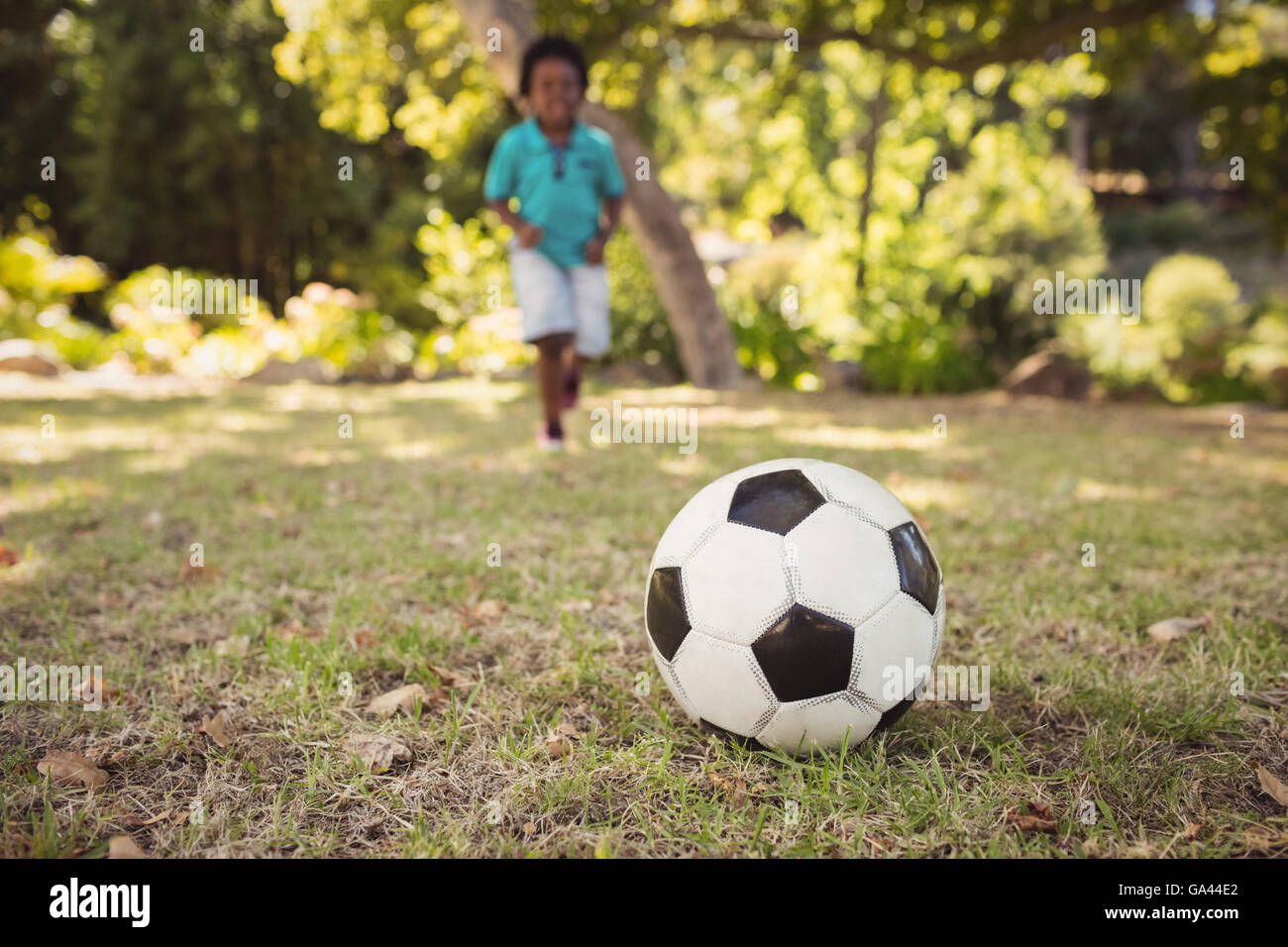 happy child playing football Stock Photo - Alamy