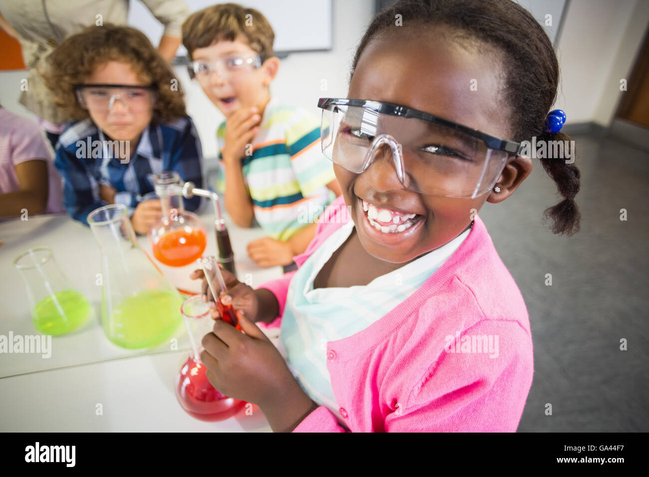 Kids doing a chemical experiment in laboratory Stock Photo - Alamy