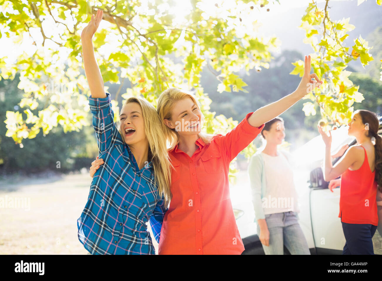 Beautiful women having a fun in park Stock Photo - Alamy