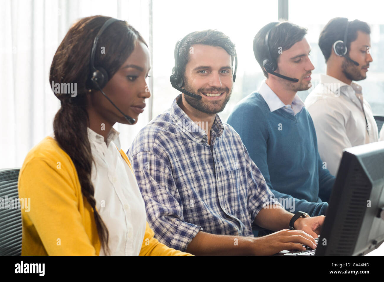 Young black woman headset working hi-res stock photography and images ...