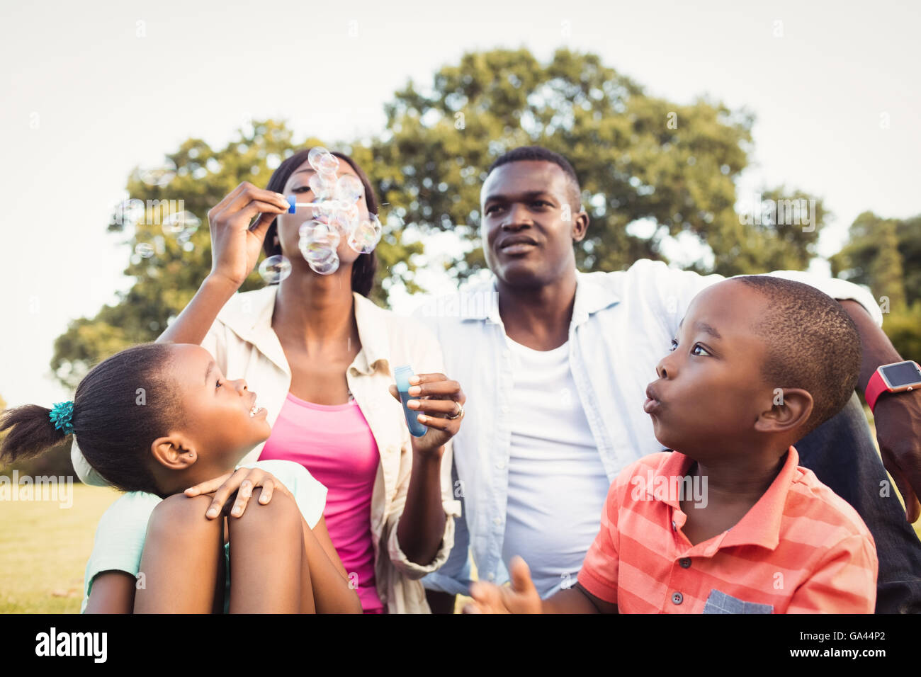 Happy family enjoying together Stock Photo - Alamy