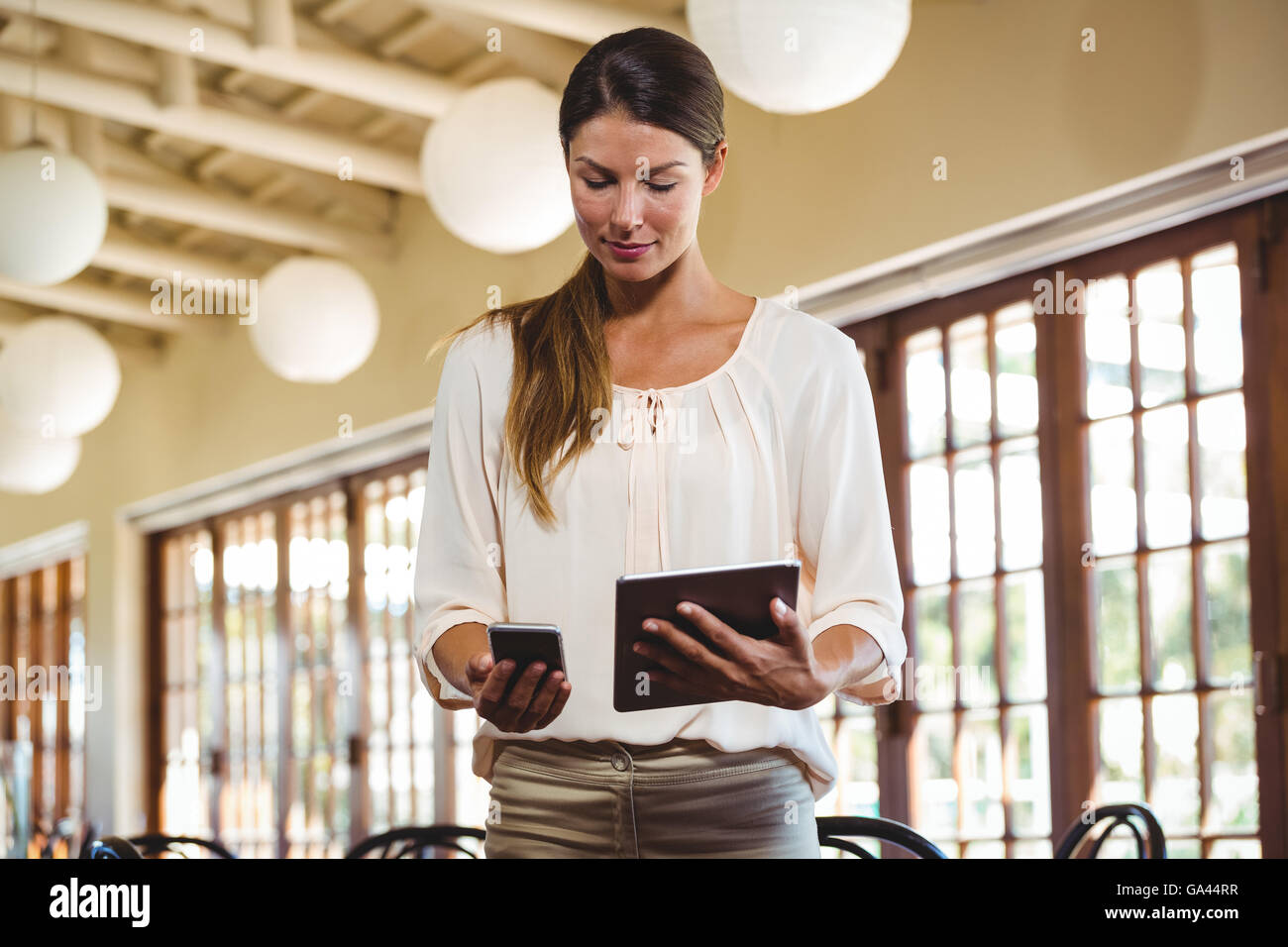 Woman using technology hi-res stock photography and images - Alamy