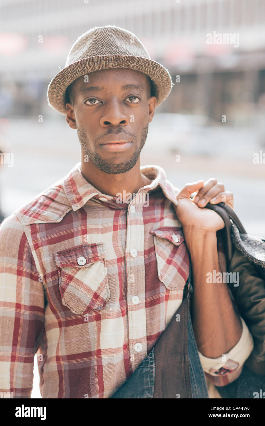 Half length portrait of young handsome afro black man looking in camera ...