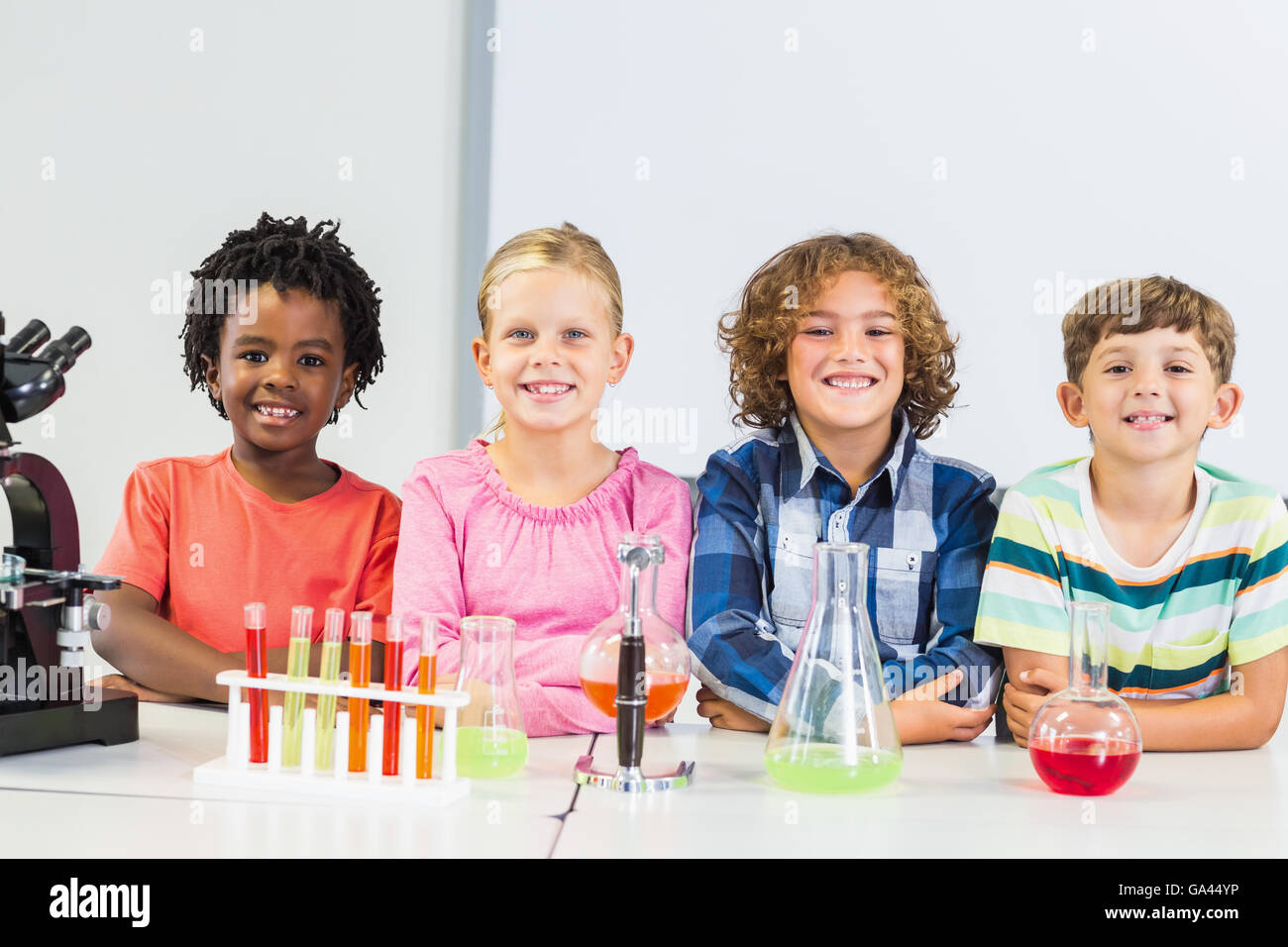 Portrait of kids doing a chemical experiment in laboratory Stock Photo ...